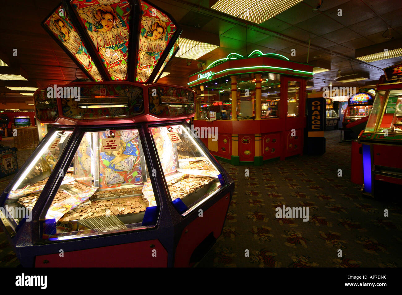 Amusement arcade with coin cascade machine Stock Photo - Alamy