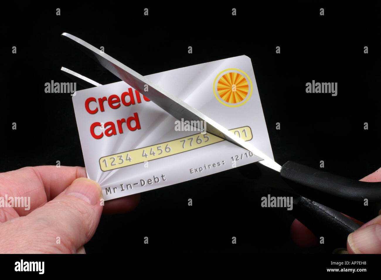 Cutting up a credit card Stock Photo - Alamy
