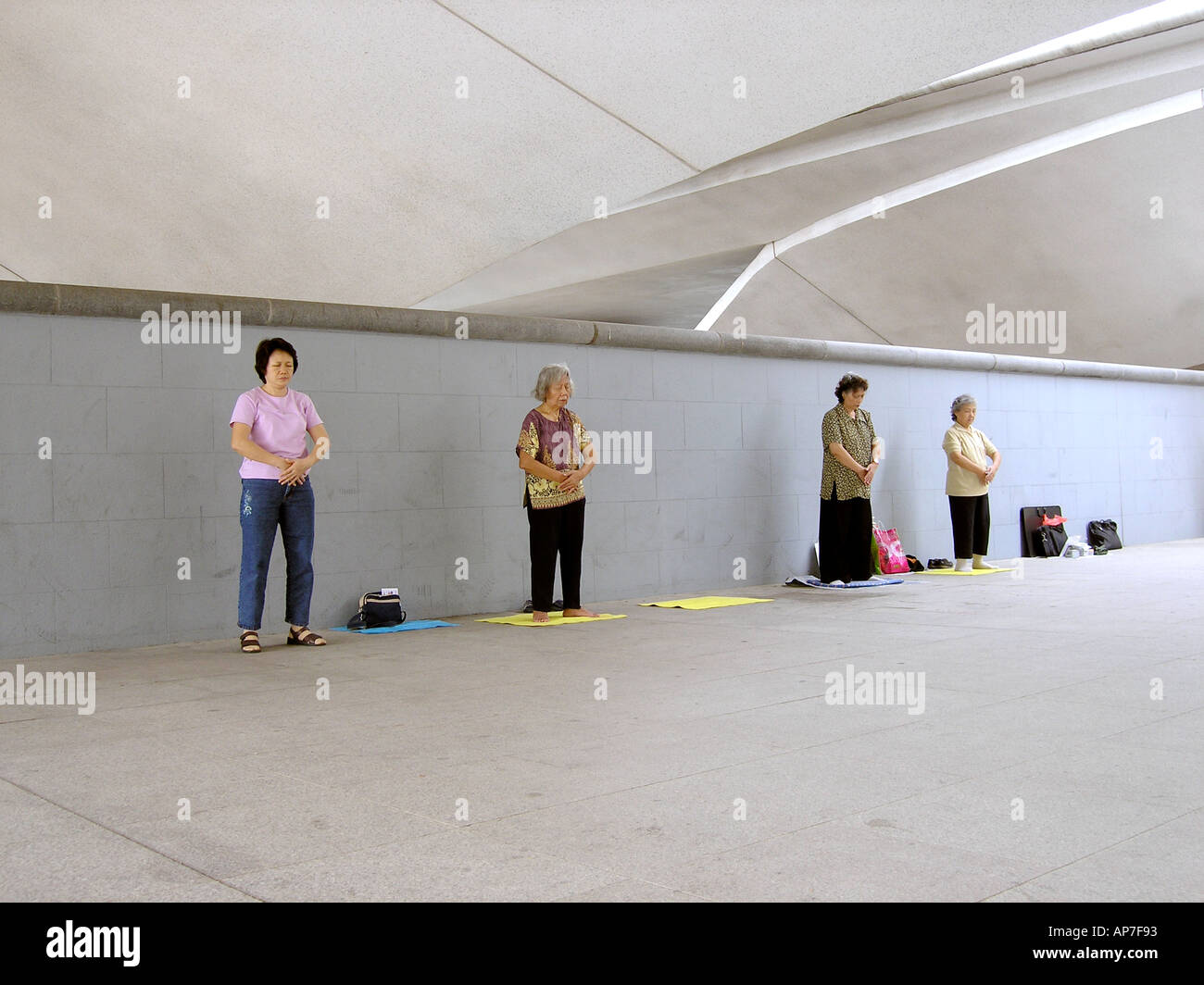 Women finishing Falun Gong exercises in underpass Singapore Stock Photo ...