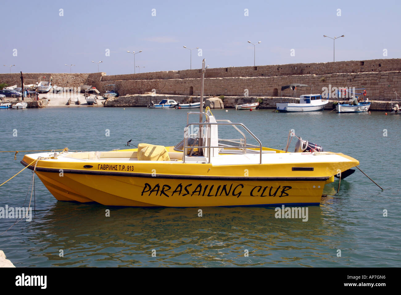 A WATERSPORT BOAT IN THE HARBOUR OF THE OLD TOWN OF RETHYMNON. CRETE ...