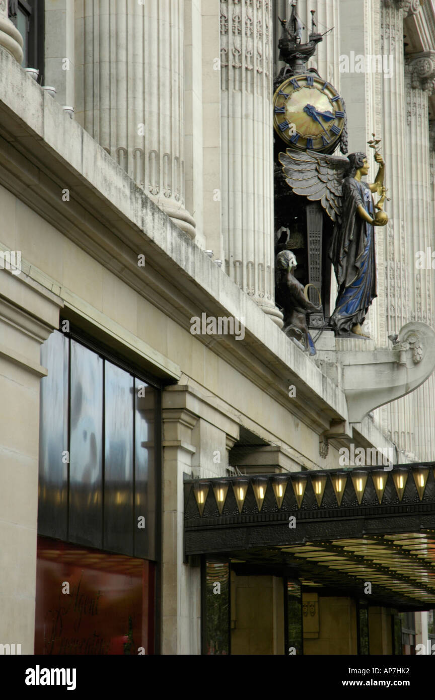 Statue and clock above Selfridges department store Oxford Street London ...