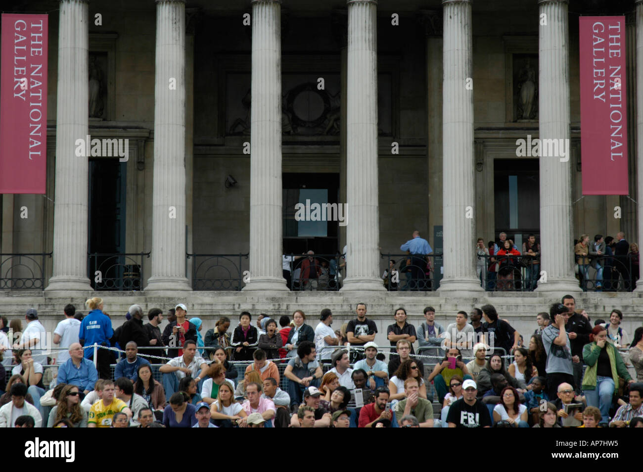 Crowd sitting on steps below the National Gallery in Trafalgar Square ...