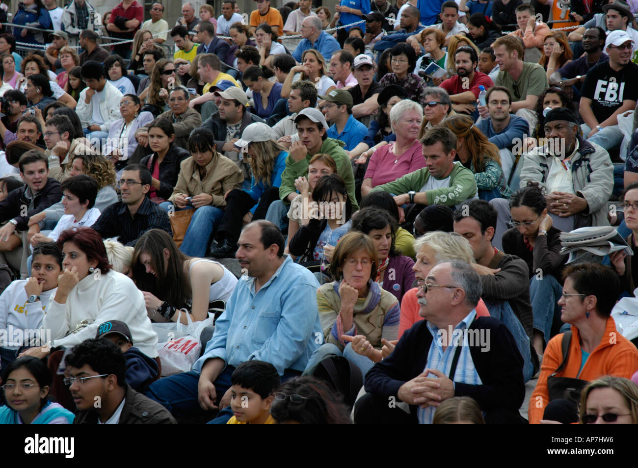 Crowd of people sitting on steps Stock Photo - Alamy