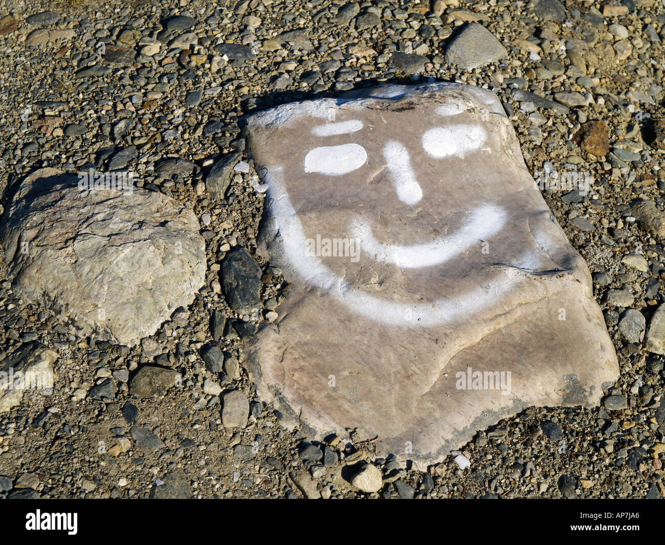 stone with smiling face Stock Photo - Alamy
