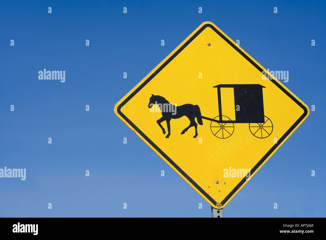 Road sign warning of horse-drawn buggys Stock Photo - Alamy