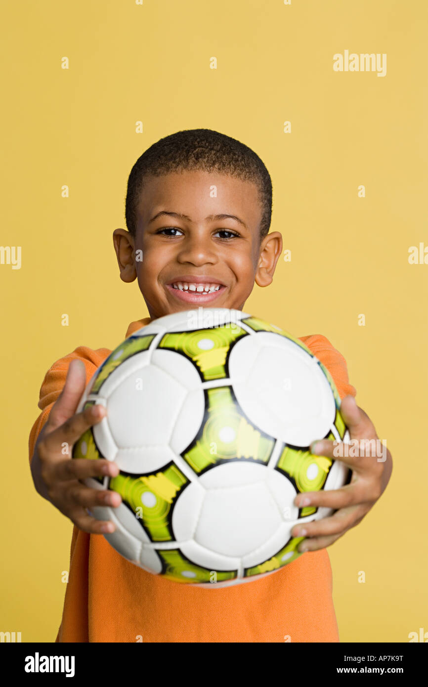 Boy with a football Stock Photo - Alamy