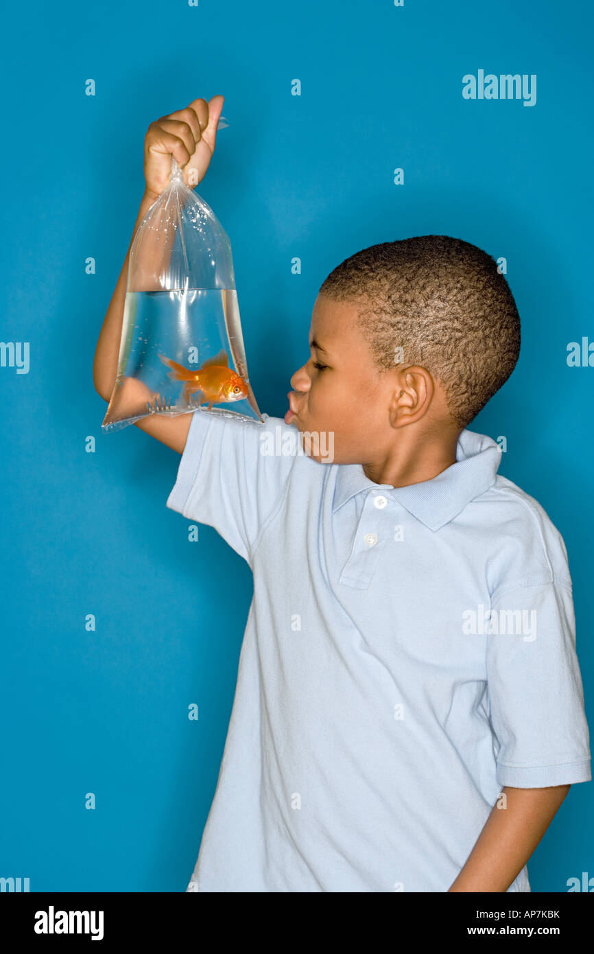 Boy with a goldfish Stock Photo - Alamy