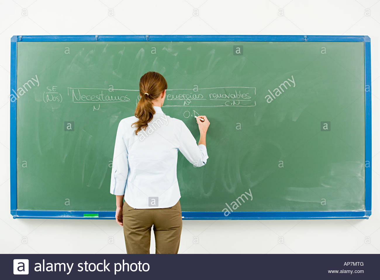 Teacher Writing On Blackboard Stock Photos & Teacher Writing On ...