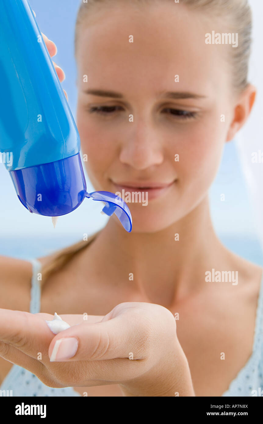 Pouring sun cream hi-res stock photography and images - Alamy