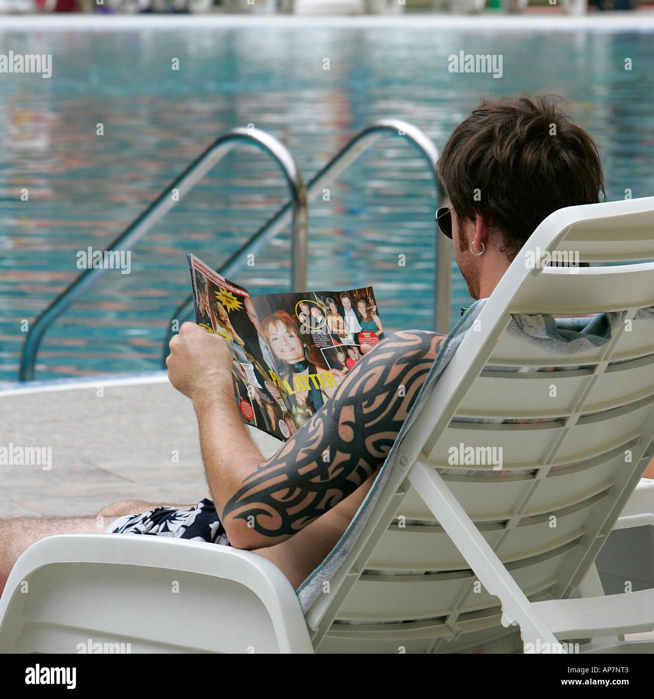 boy pool tattoo read magazine news paper happy restaurant bar tourist ...