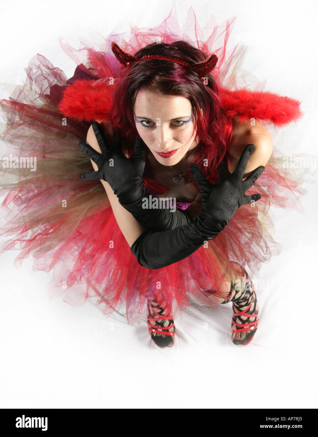 Girl in a Tutu Net Stockings Black Basque Red Wings and Horns Stock ...