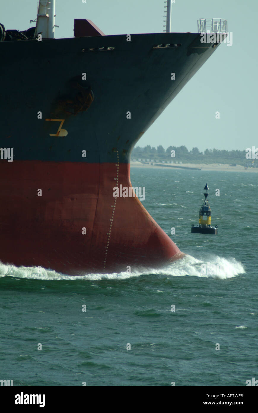bow wave of large ship with east cardinal navigation light Stock Photo ...