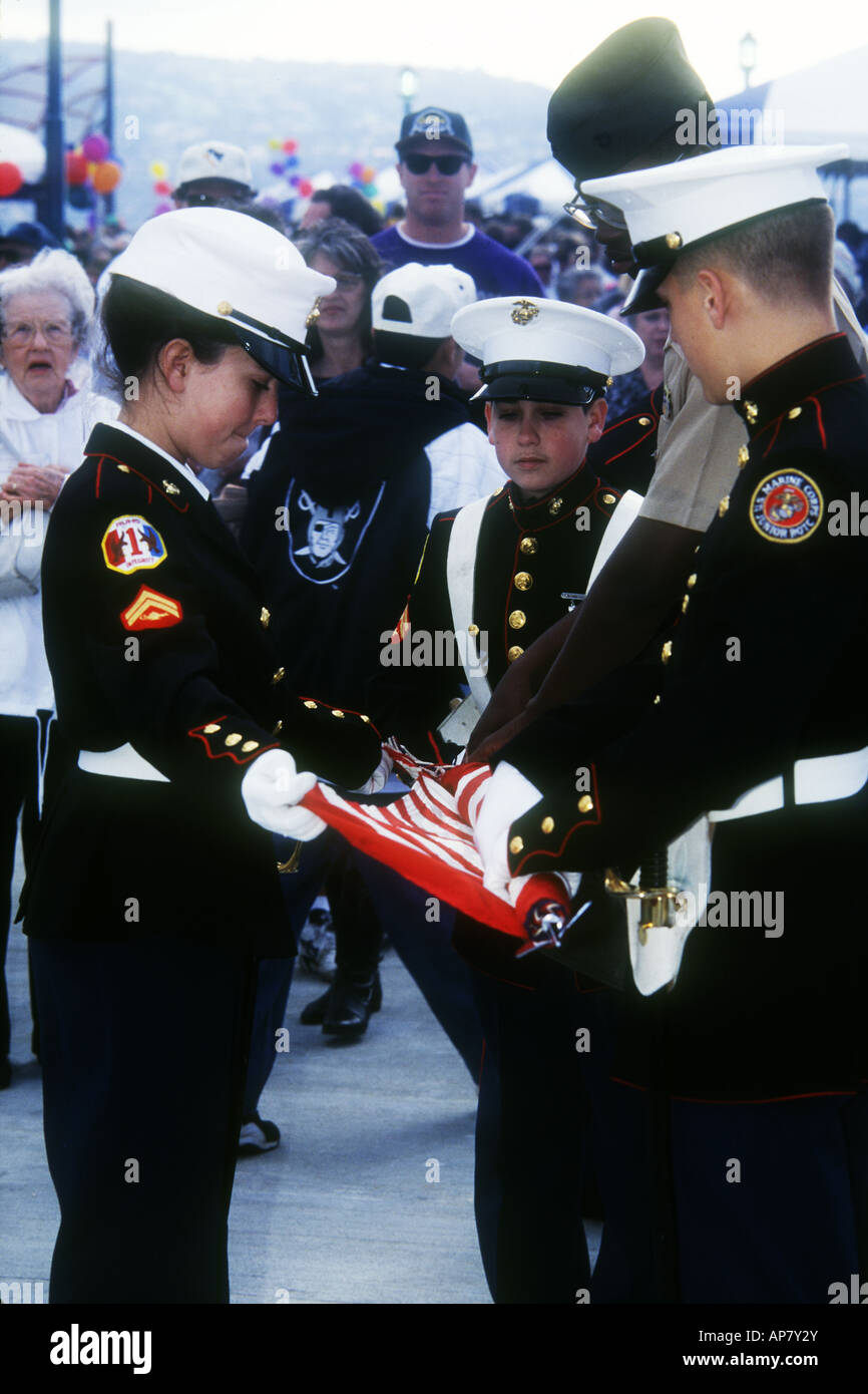 Junior Marine ROTC members fold American flag Stock Photo - Alamy