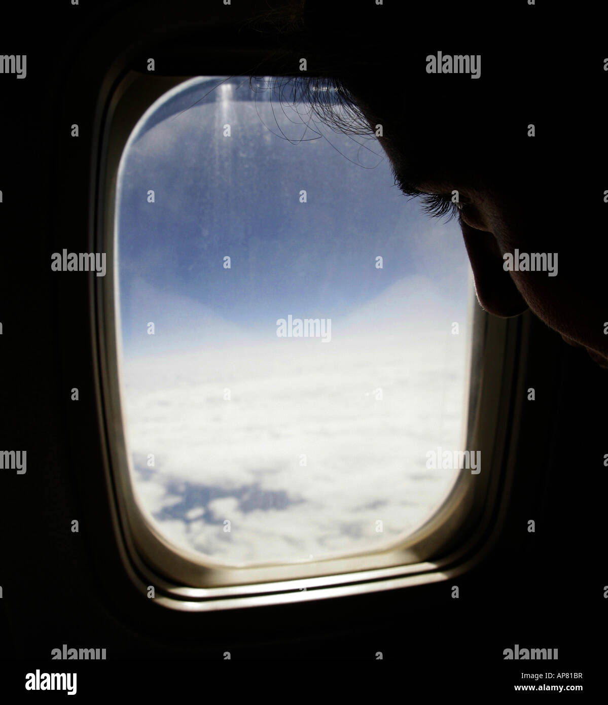 passenger looking through air plane window Stock Photo - Alamy