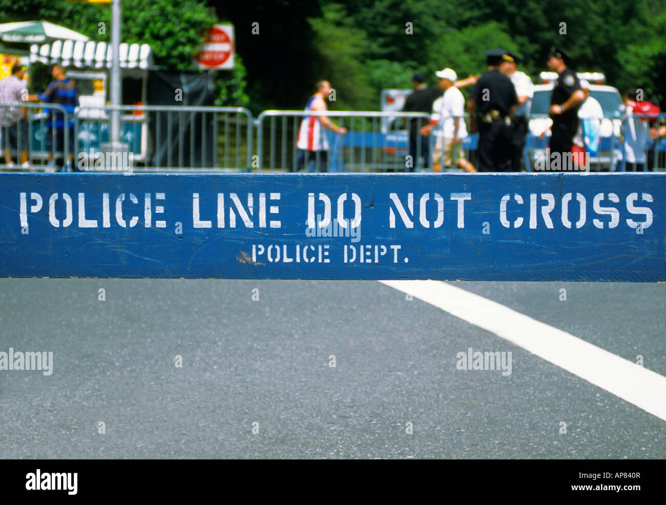Police barrier Police Department Do Not Cross barricade. Crowd at ...