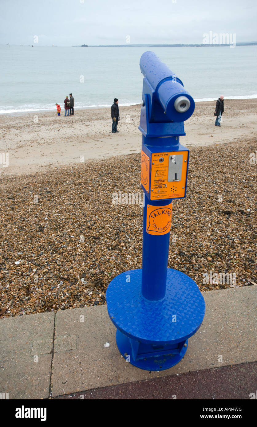 Seaside telescope and people on beach Stock Photo - Alamy