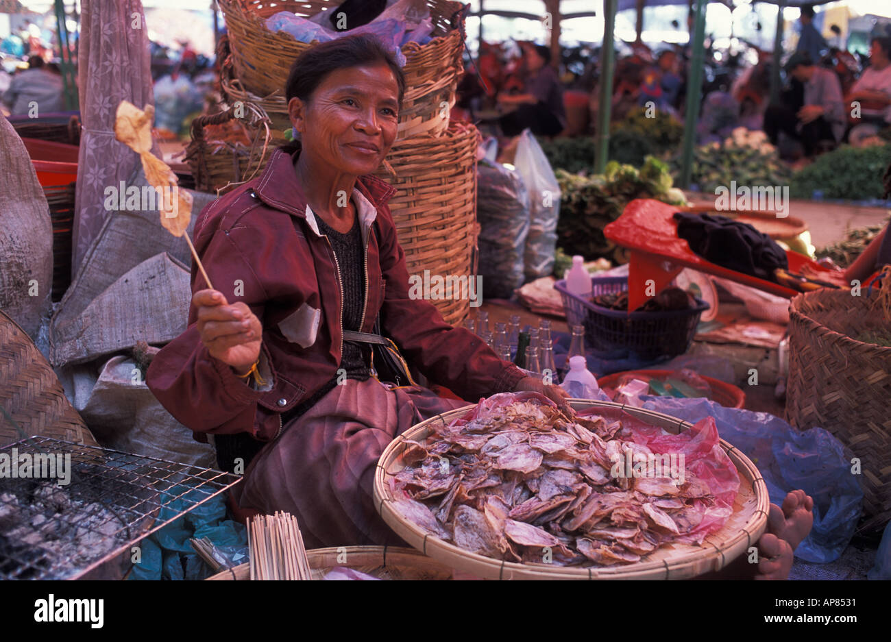friendly dried squid vendor at central market by bus terminal Vientiane ...