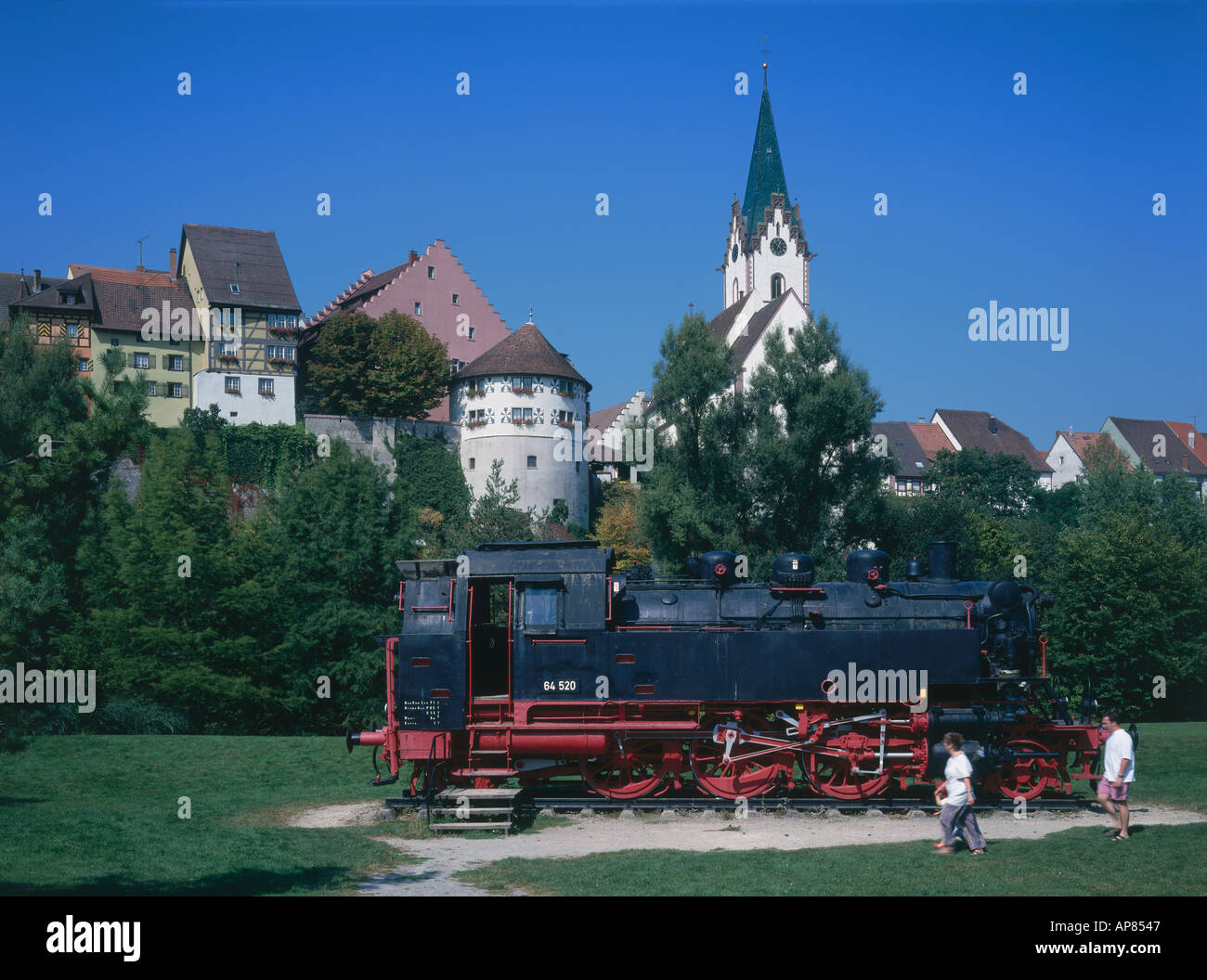 two people near steam locomotive engine in garden, Baden-Wurttemberg ...