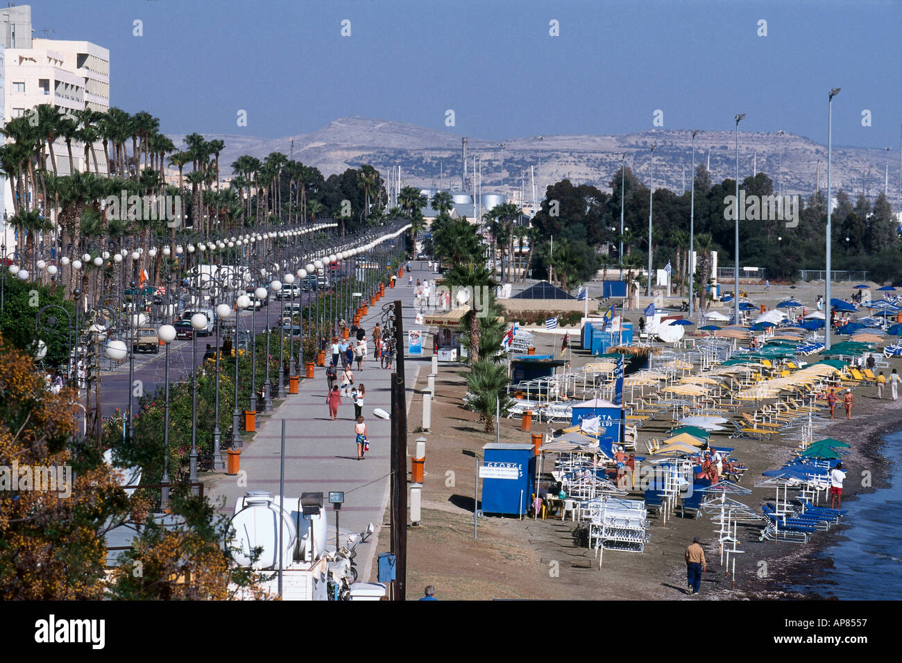 Tourist walking at promenade on beach, Larnaca, Cyprus Stock Photo - Alamy