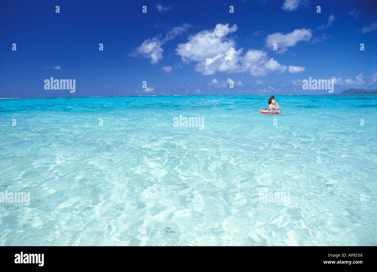 Young woman enjoying the crystal clear waters of Saipan N Marianas ...