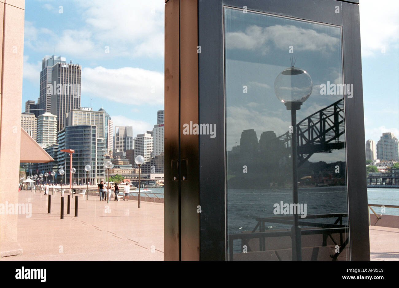 Sydney Harbour Bridge reflected in an Opera House sign Stock Photo - Alamy