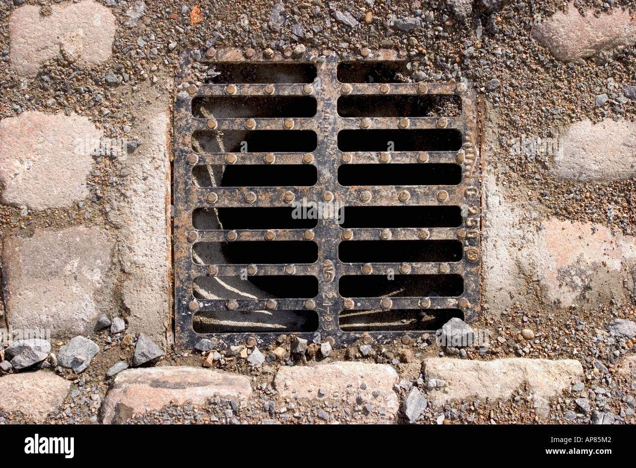 Urban texture and detail of sewer entry in a city of france Stock Photo ...