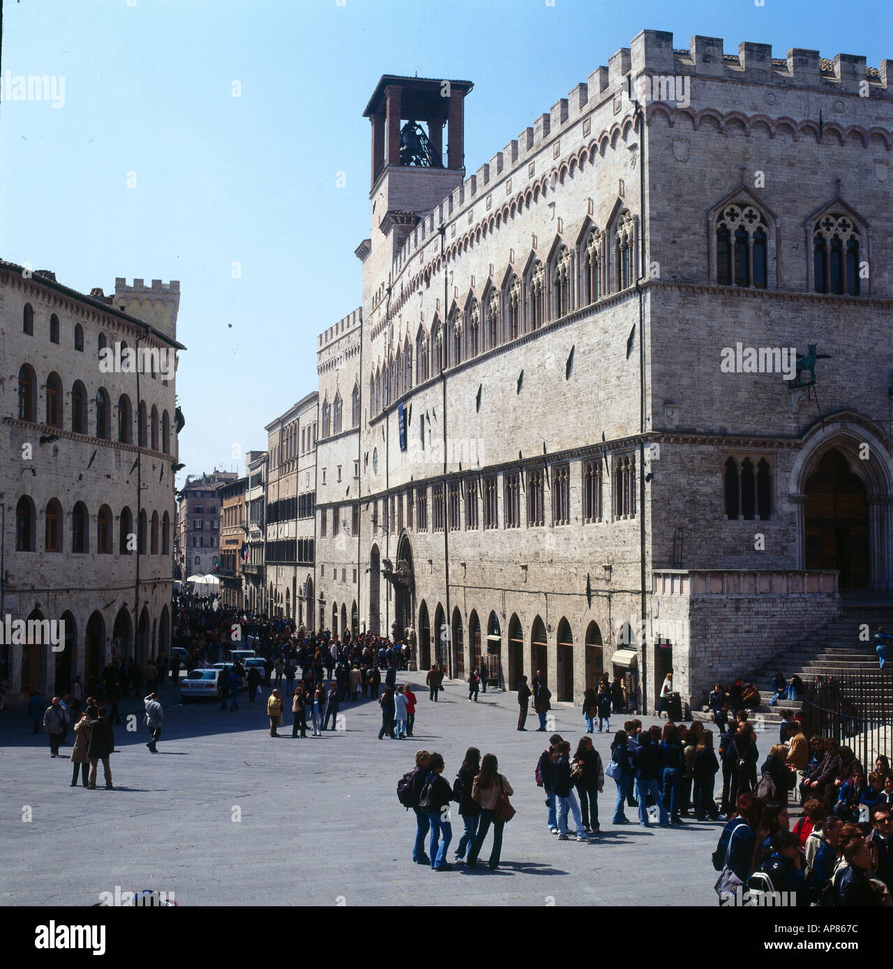 Large group of people walking in front of palace, Perugia, Umbria ...