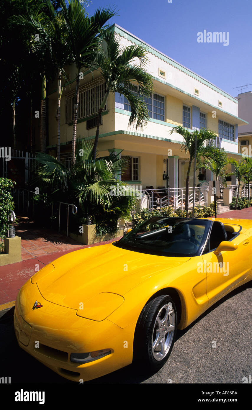 Corvette automobile in front of art deco apartment building Miami Beach ...