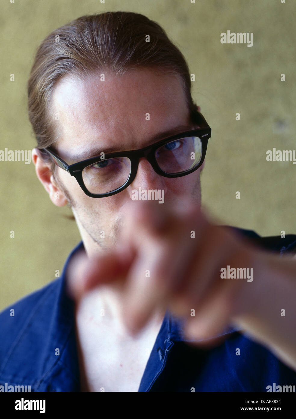 Portrait of young man pointing towards camera Stock Photo - Alamy Portrait of young man pointing towards camera Stock Photo - Alamy