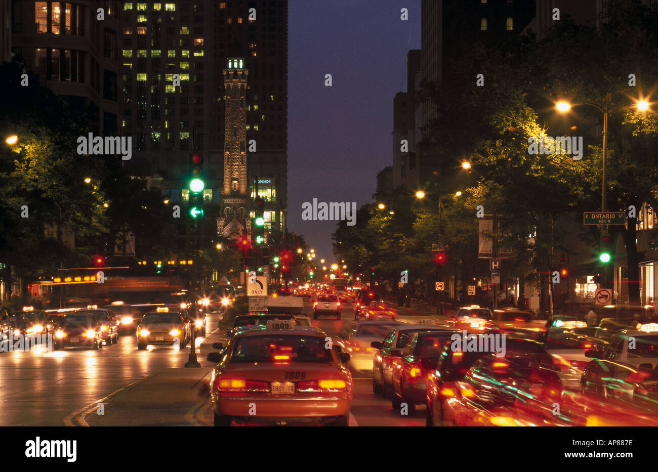 Busy street scene at night, Water Tower Place, Chicago, Illinois, USA ...