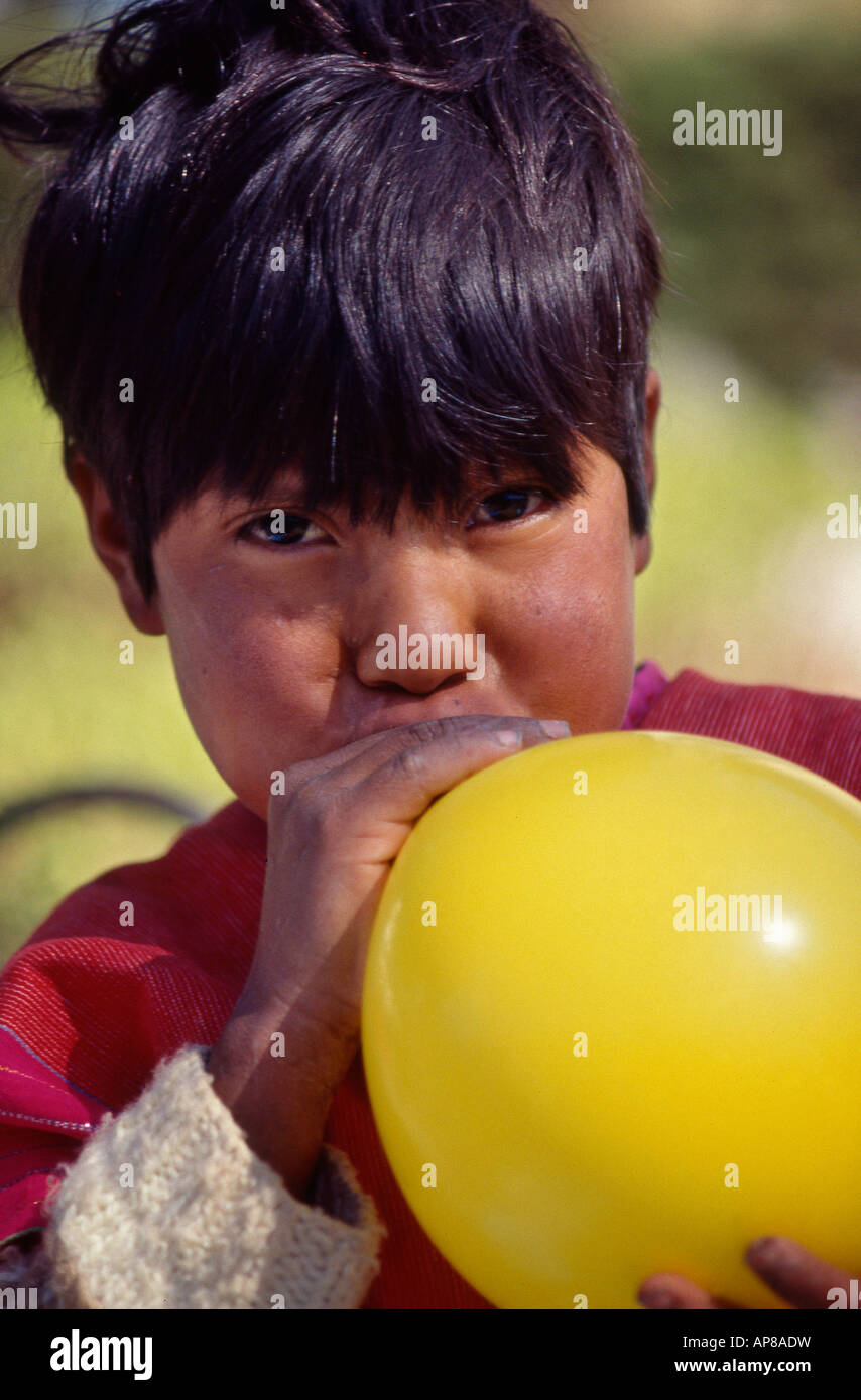 Local Boy inflating Balloon Mexico Stock Photo - Alamy