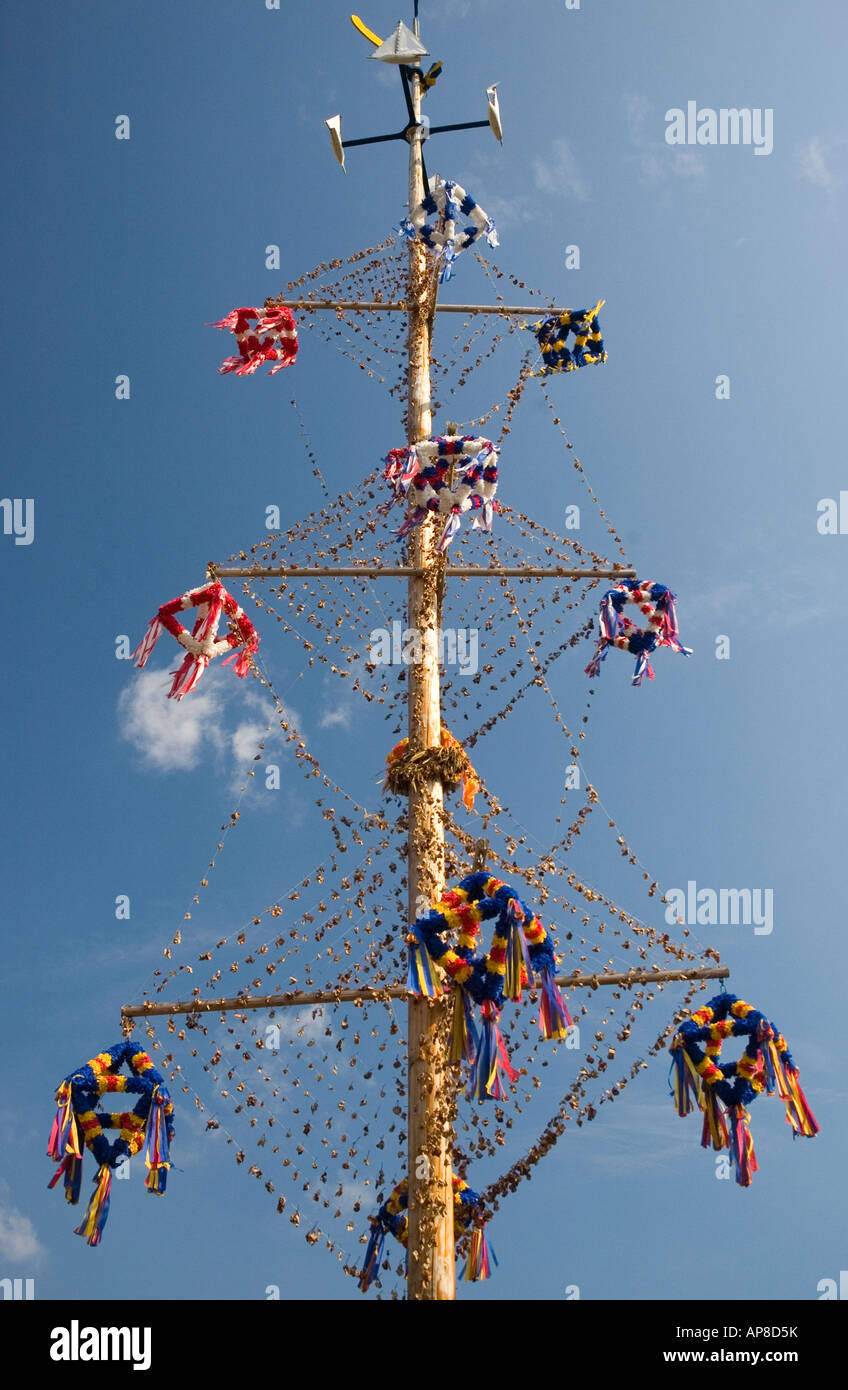 Midsummer festival pole in Mariehamn with garlands displaying the Åland ...