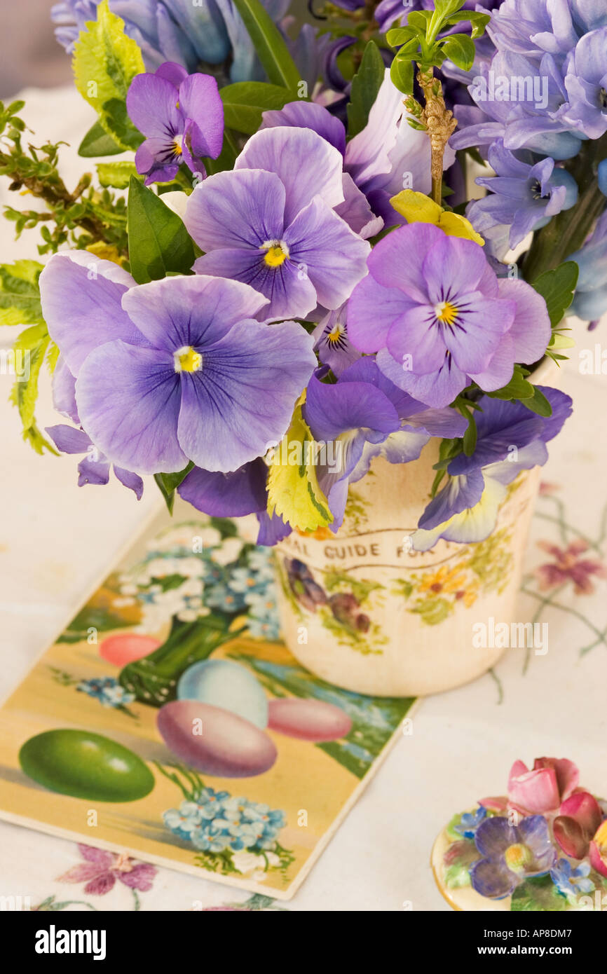 Early spring arrangement of pansies with a vintage Easter postcard ...