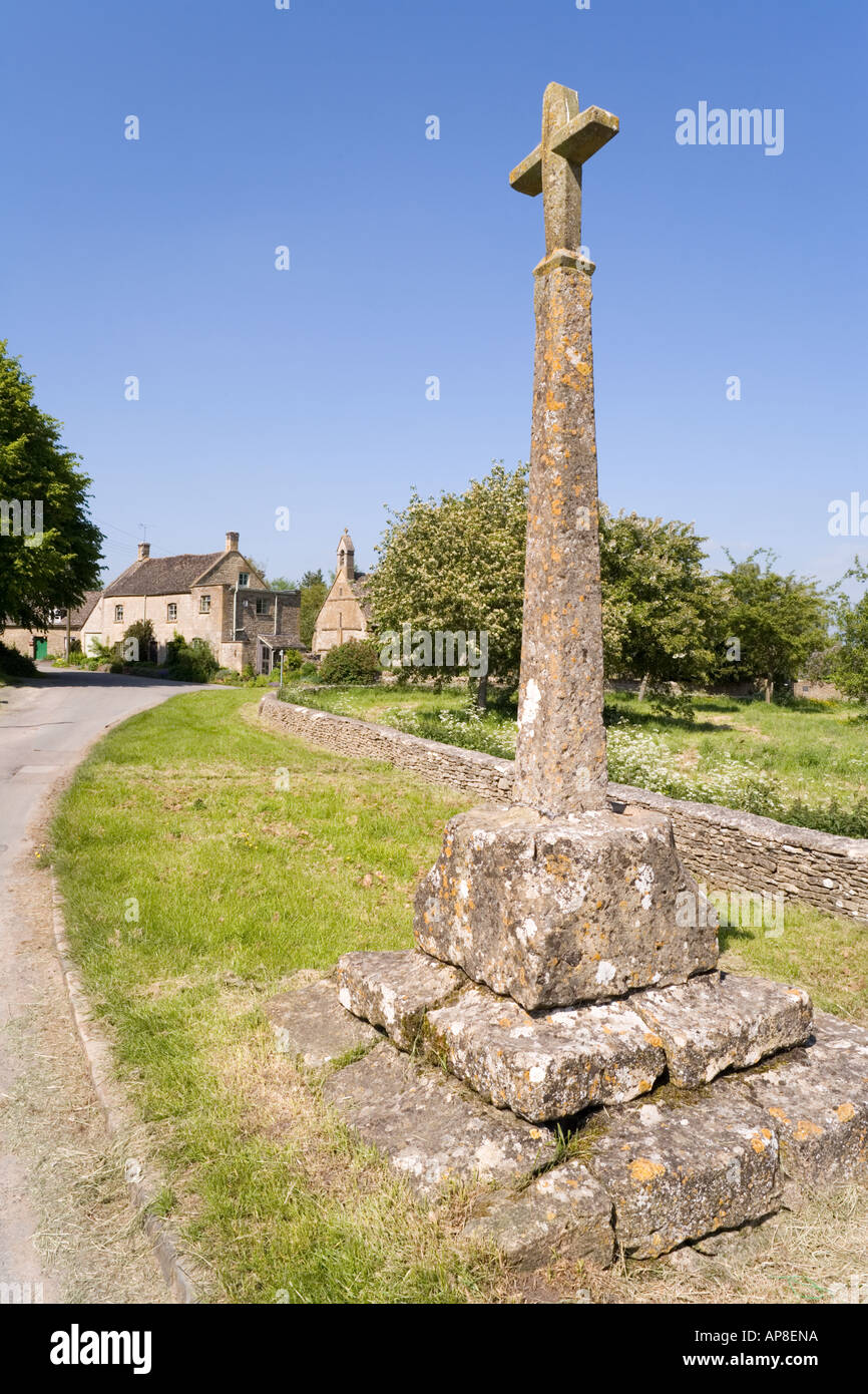 Restored 14th Century wayside preaching cross in the Cotswold village ...