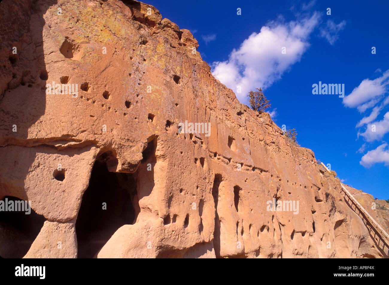Afternoon light on cave dwellings and petroglyphs at Puye Cliff ...