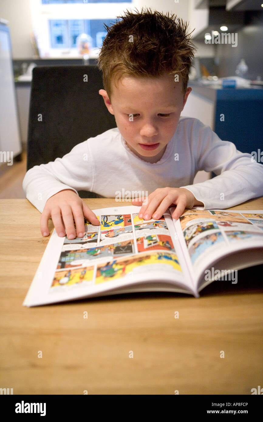 Reading a comic hi-res stock photography and images - Alamy