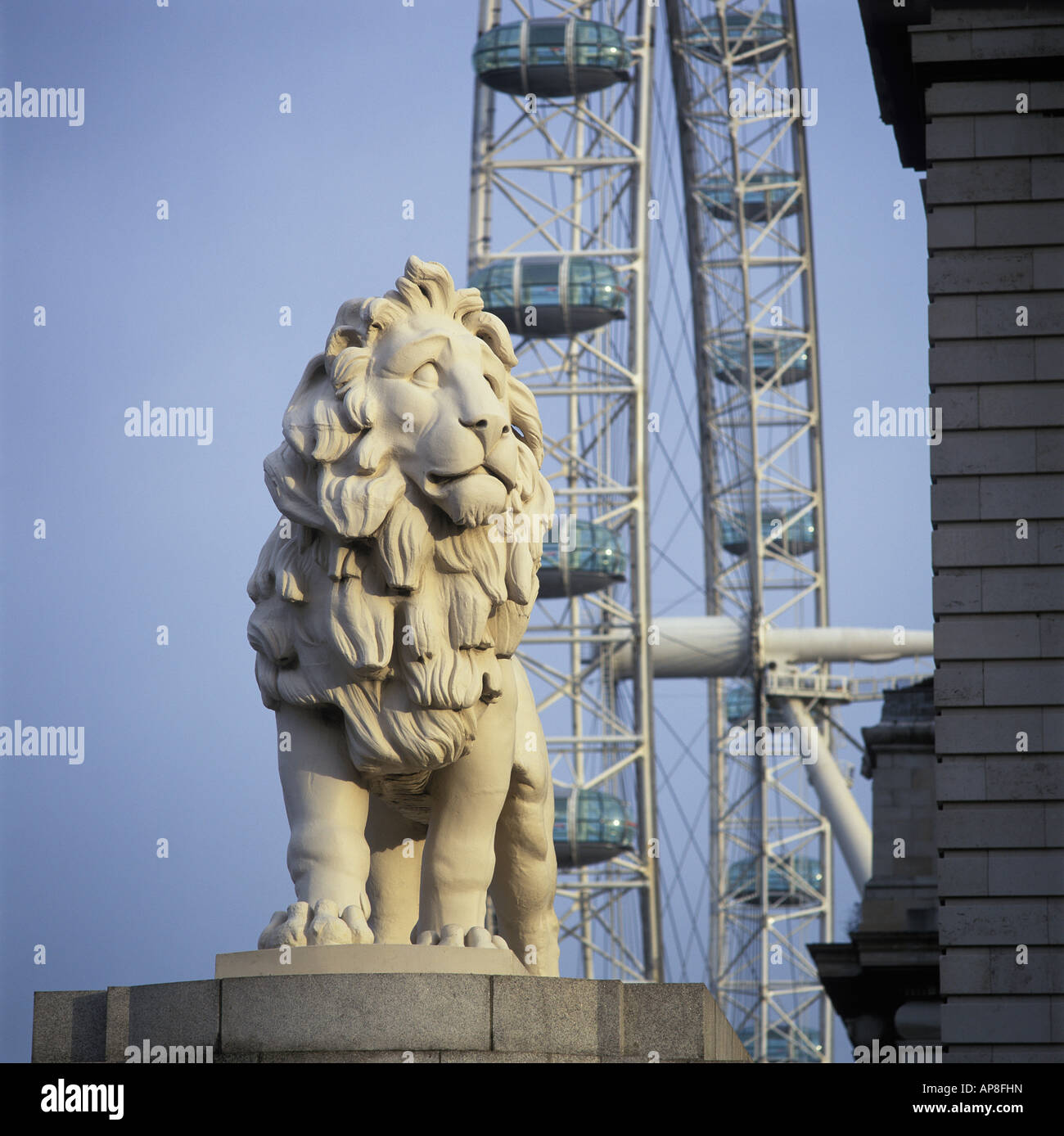 The London Eye with Lion statue in foreground Stock Photo - Alamy