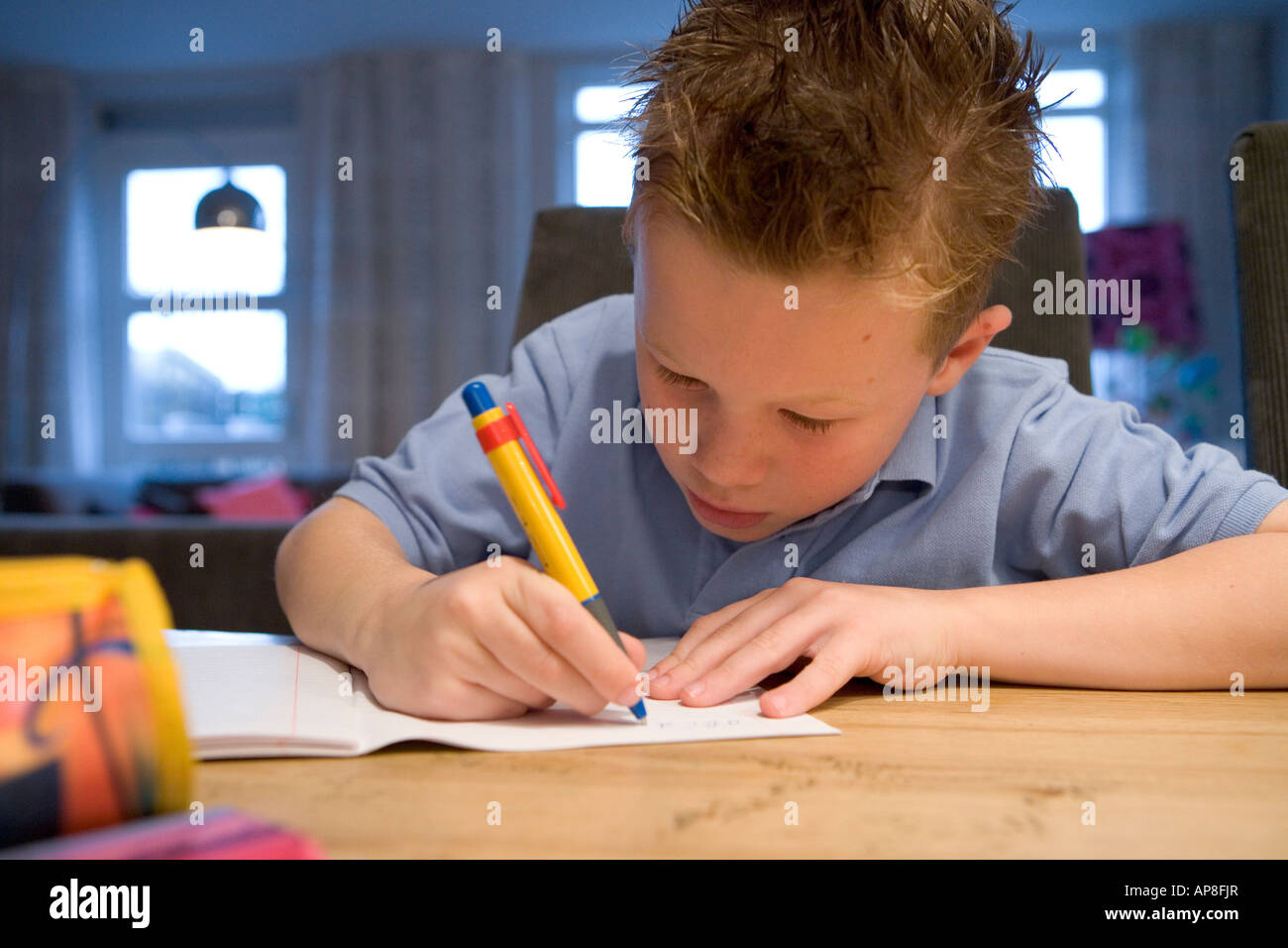 Boy is making his homework Stock Photo - Alamy