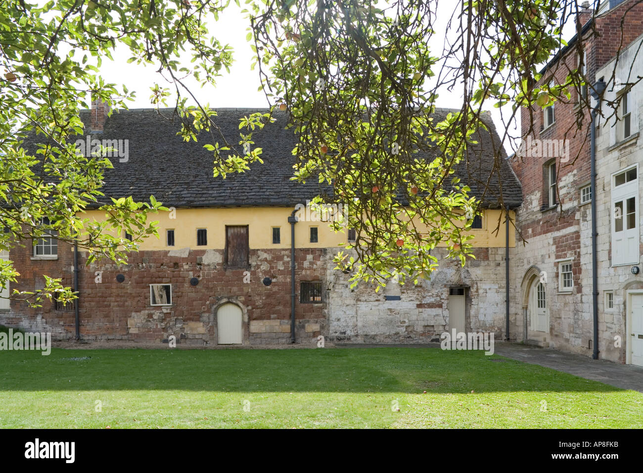 The medieval cloister (completed in 1239) beside the priory church of ...