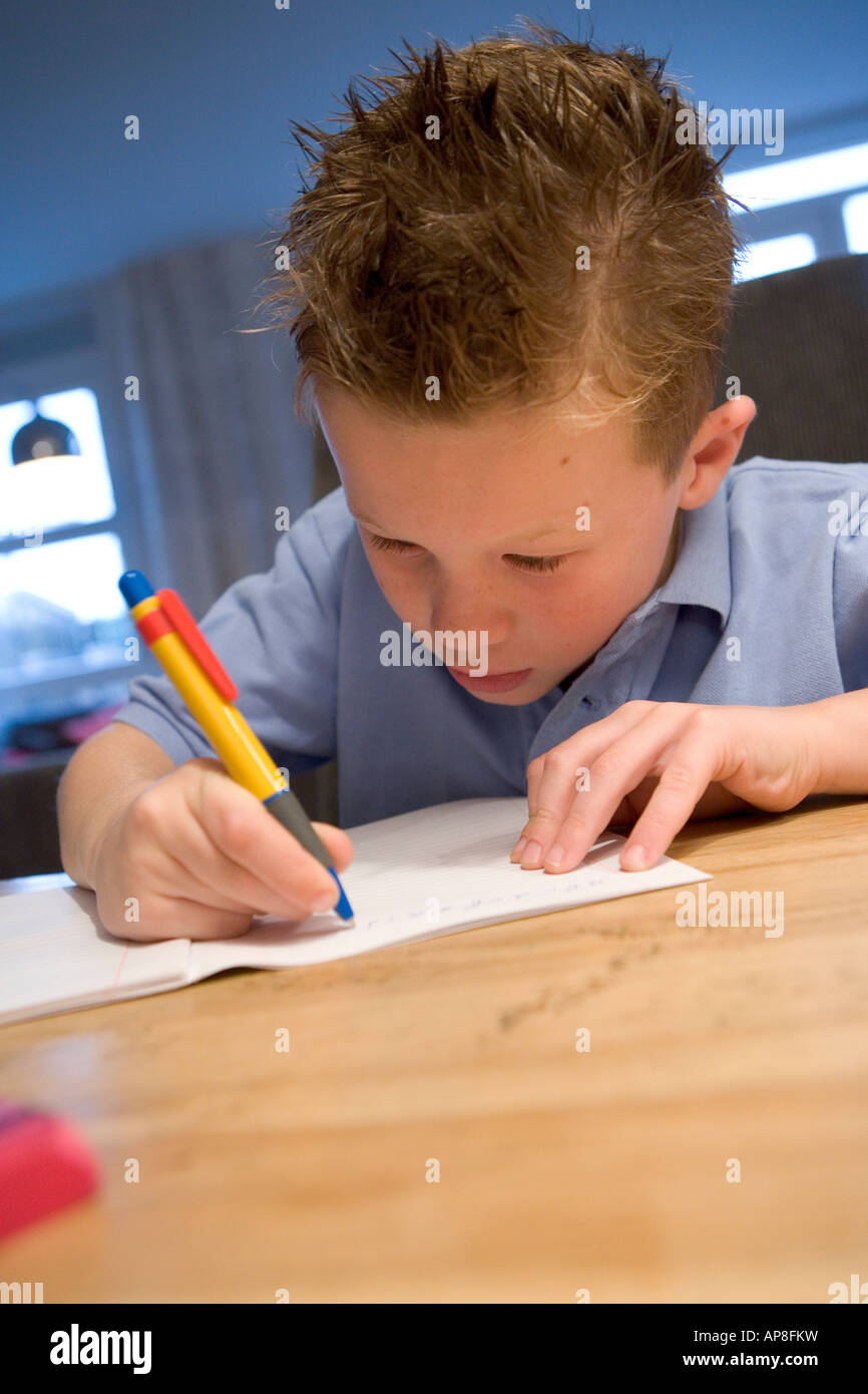 Boy is making his homework Stock Photo - Alamy