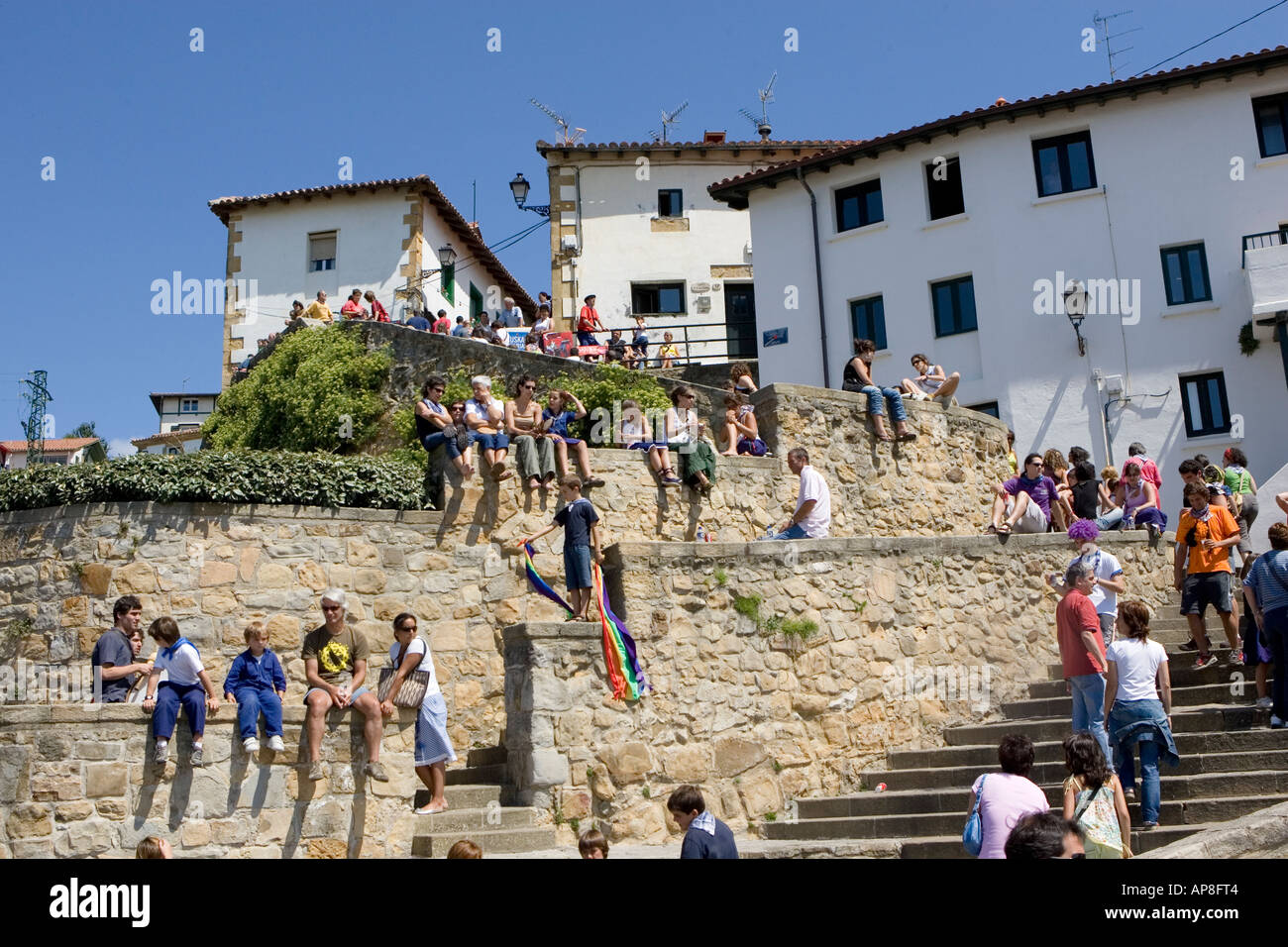Basque people sit and enjoy the sunshine Puerto Viejo de Algorta Basque ...