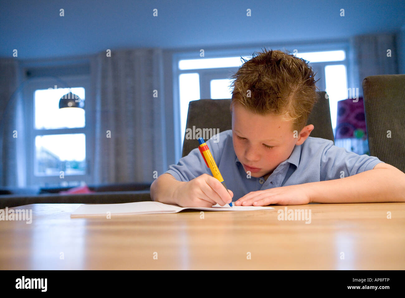 Boy is making his homework Stock Photo - Alamy