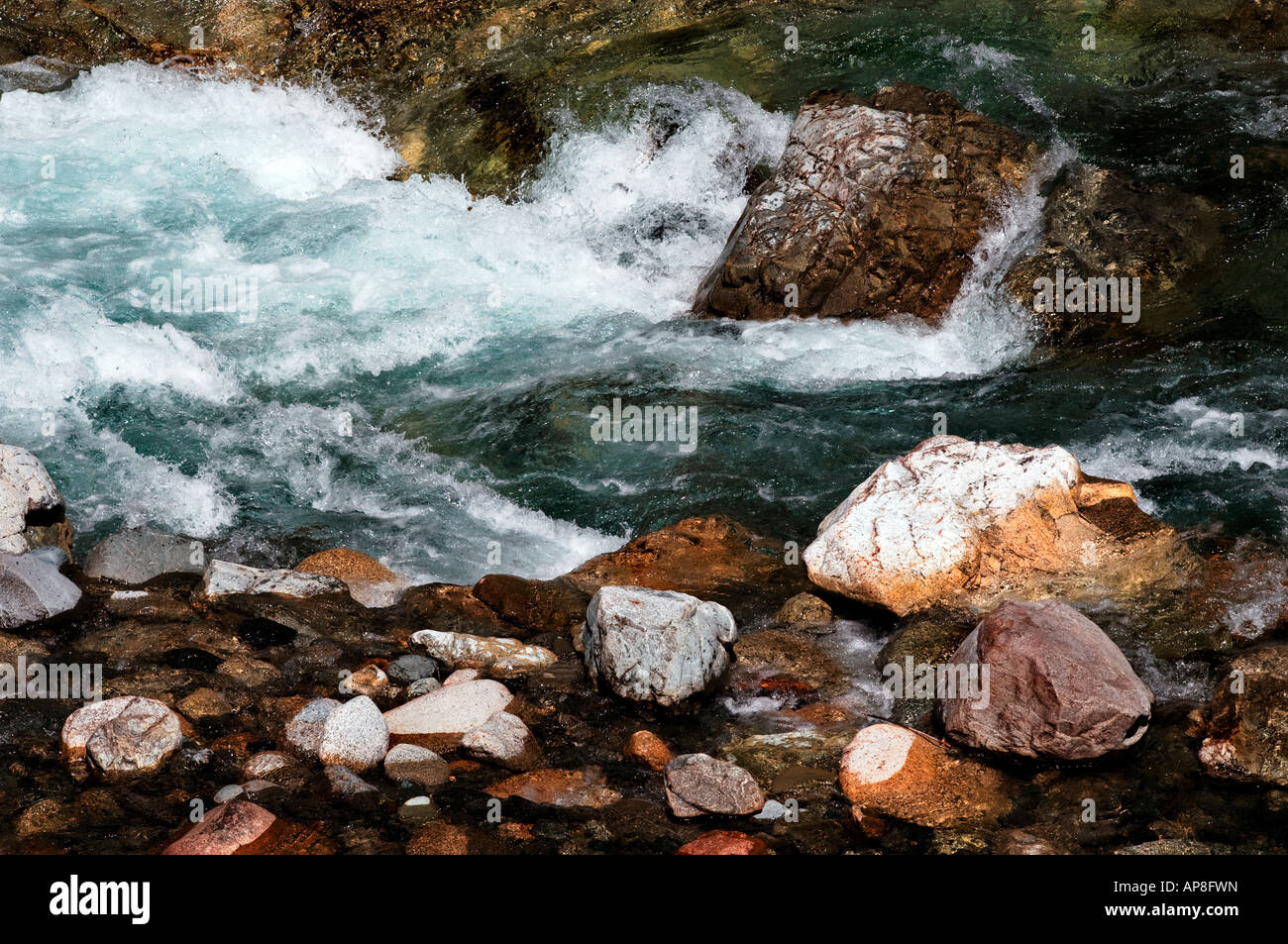 Rushing river runs through the rocks of the Northern Cascades in ...