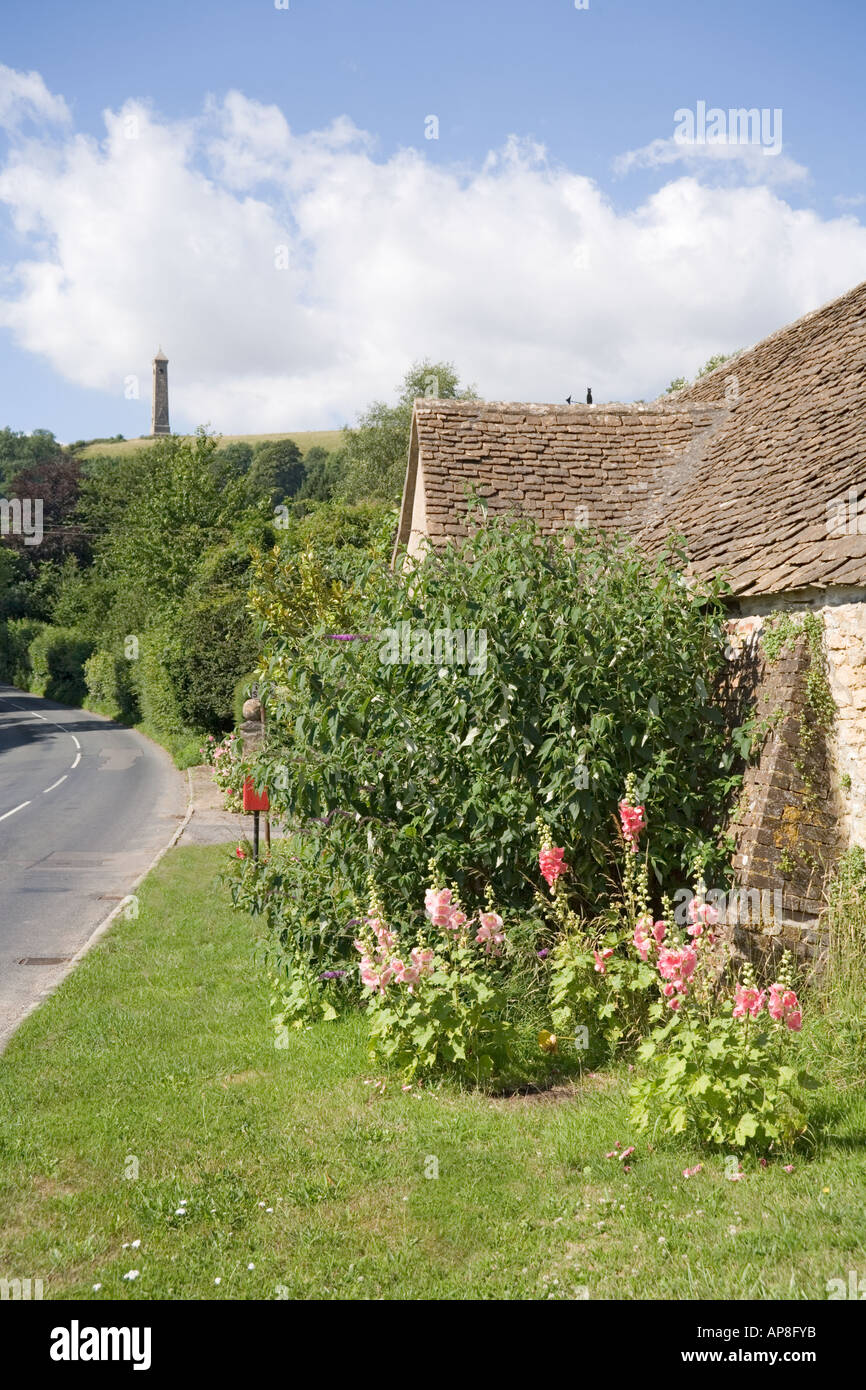 An old Cotswold barn at Southend Farm, with Tyndales Monument in the ...