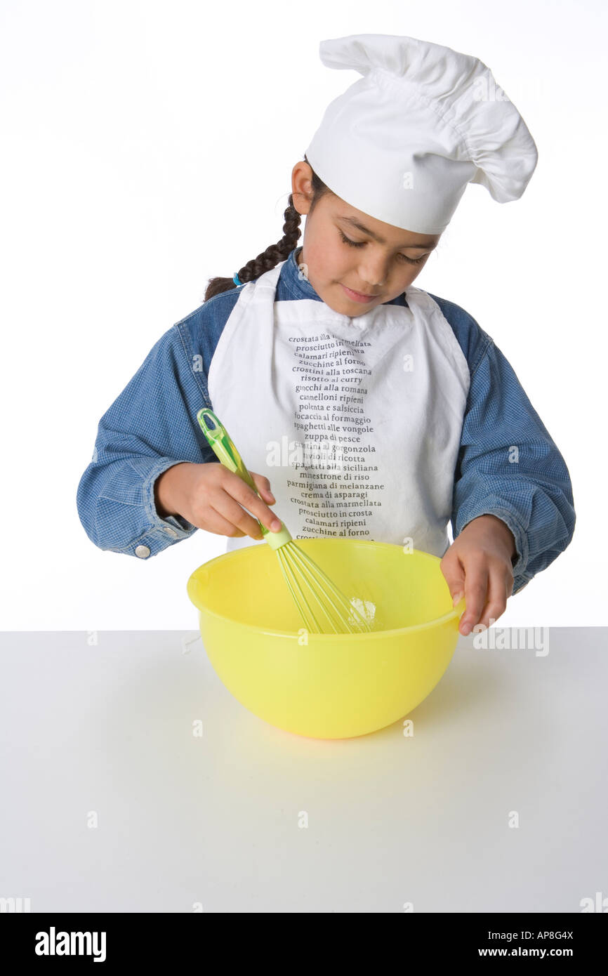 Girl is making batter for cakes Stock Photo - Alamy