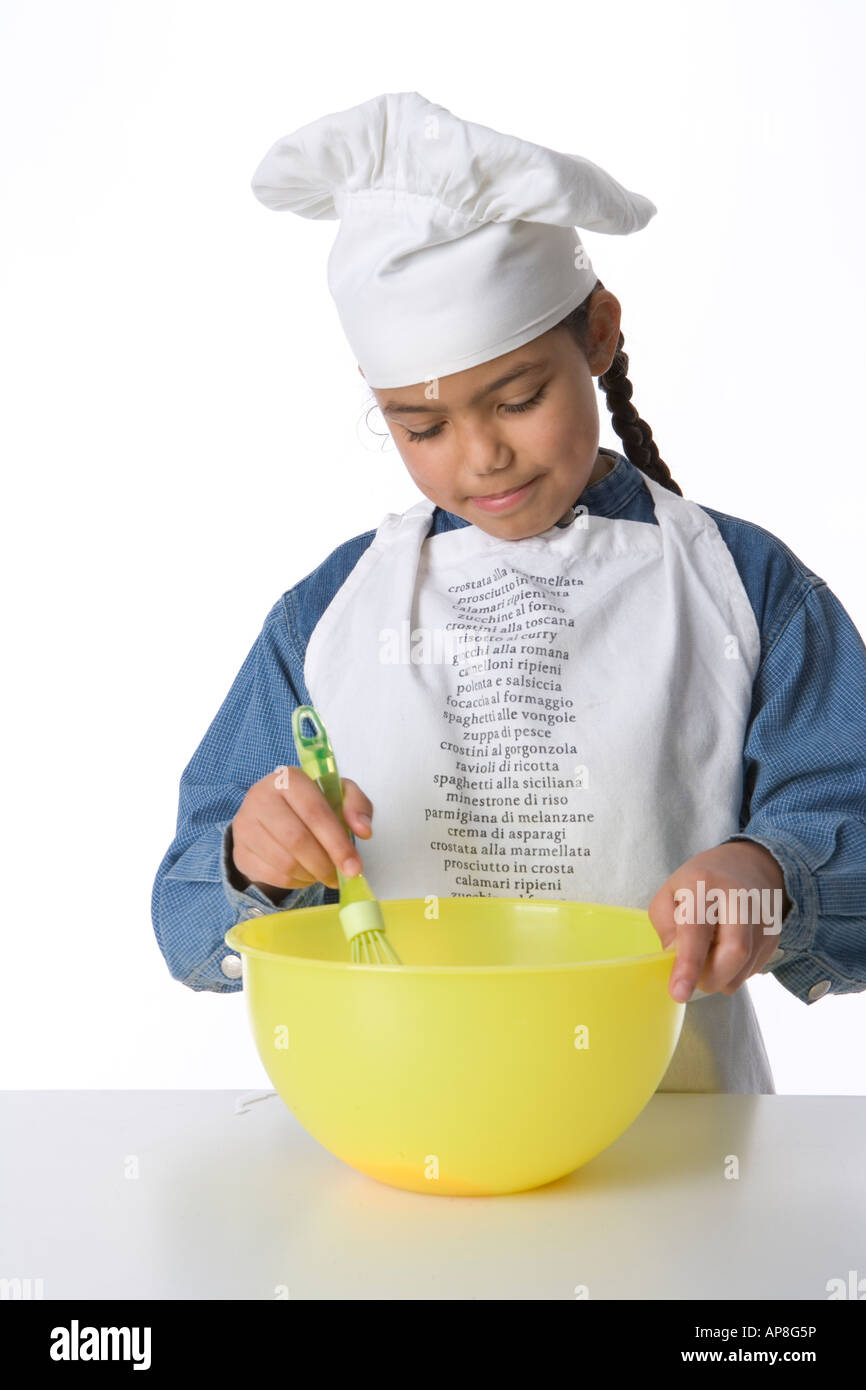 Girl is making batter for cakes Stock Photo - Alamy