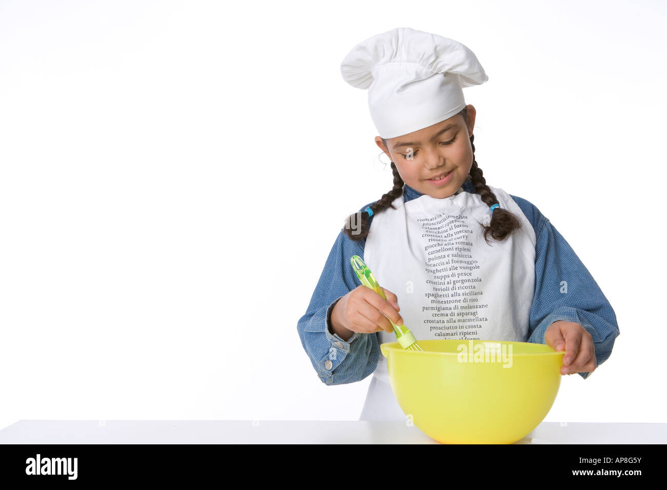 Girl is making batter for cakes Stock Photo - Alamy