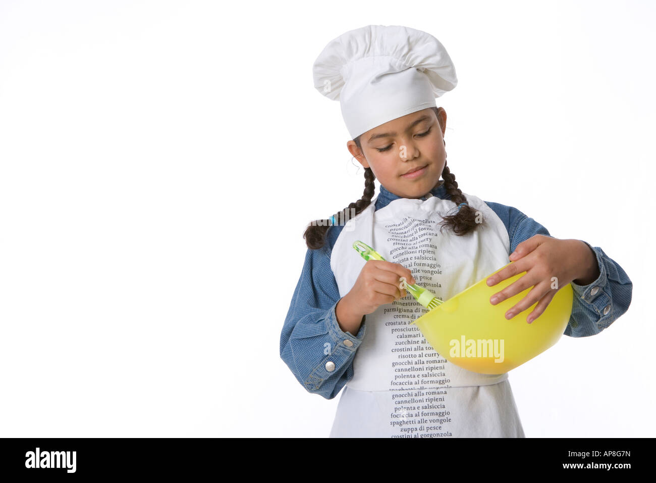 Girl is making batter for cakes Stock Photo - Alamy