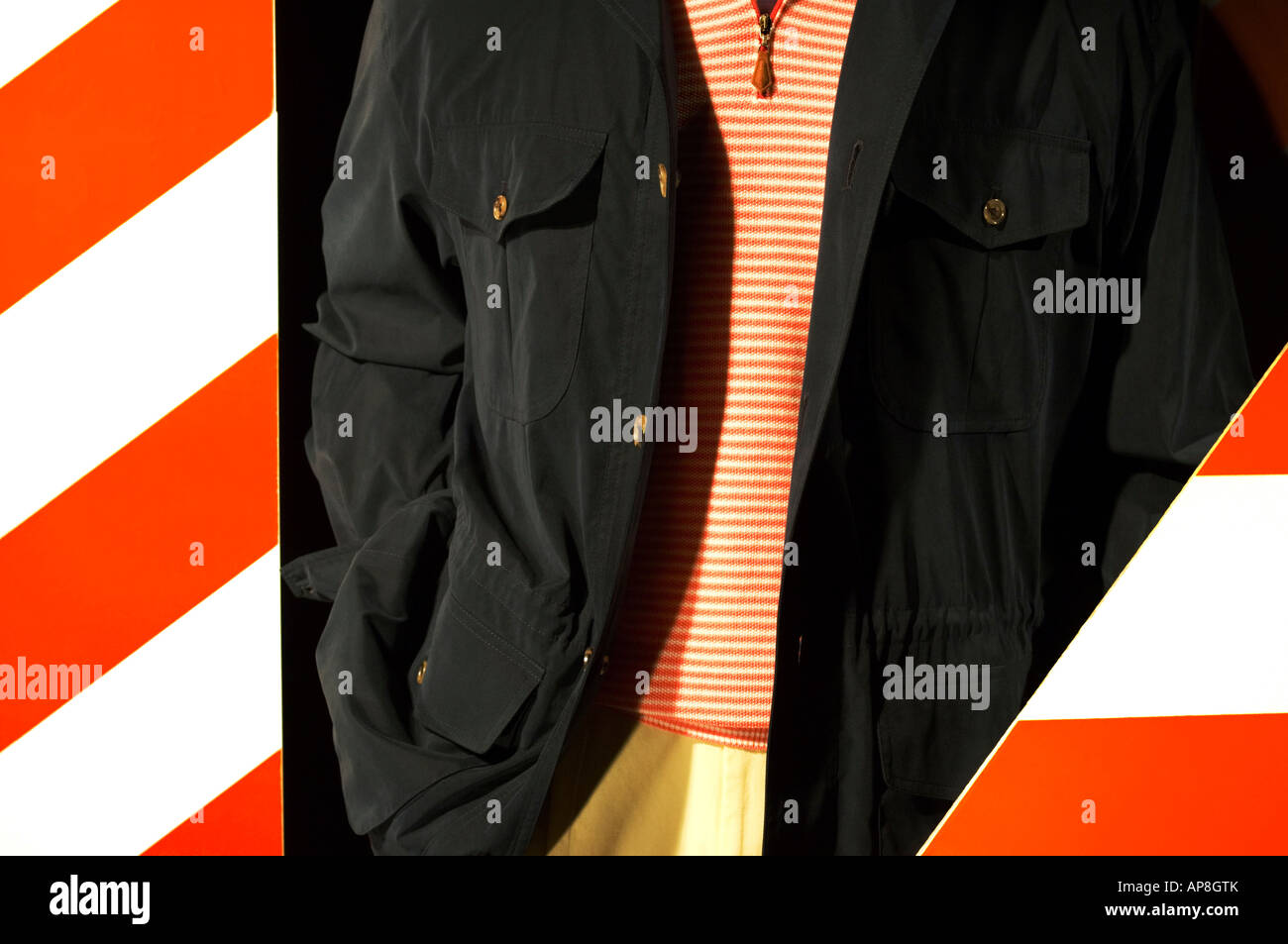 man inbetween two traffic barriers in summer clothing Stock Photo - Alamy