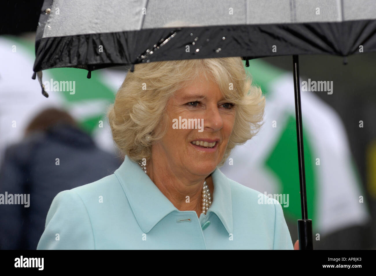 Camilla smiling in the Rain Stock Photo - Alamy
